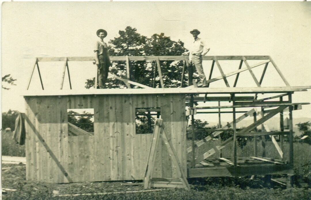 DIY Men Buidling Small House Standing on Roof Home Construction 1920s ...