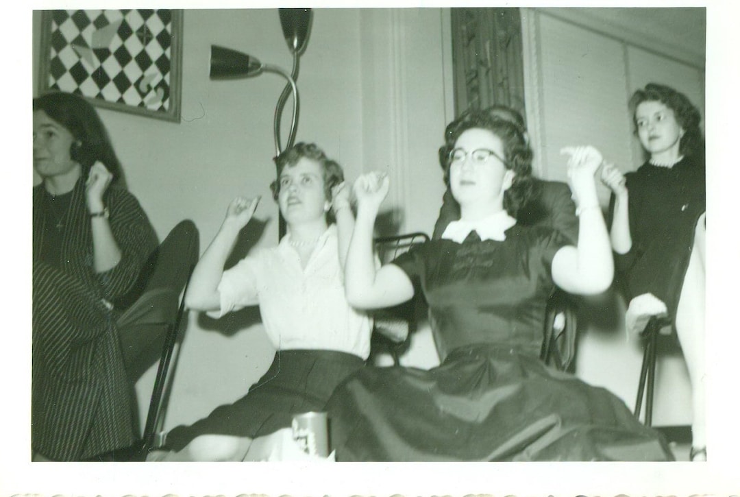 50s Women at a Party Chair Dancing Snapping Fingers Sitting Listening ...