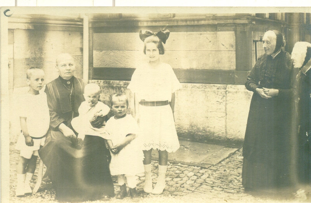 Great Grandmothers Watching Grandma Pose With Babies Inspecting Girls ...