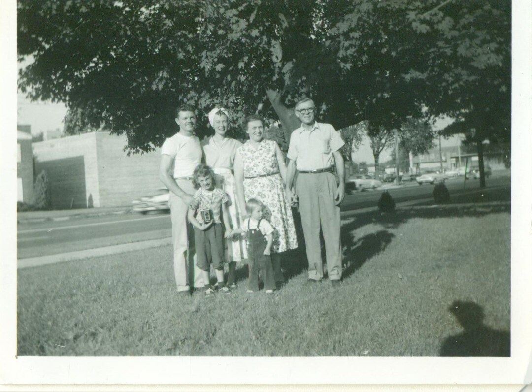 1950s Family Photo Little Girl Holding Camera Parents Grandparents 50s ...