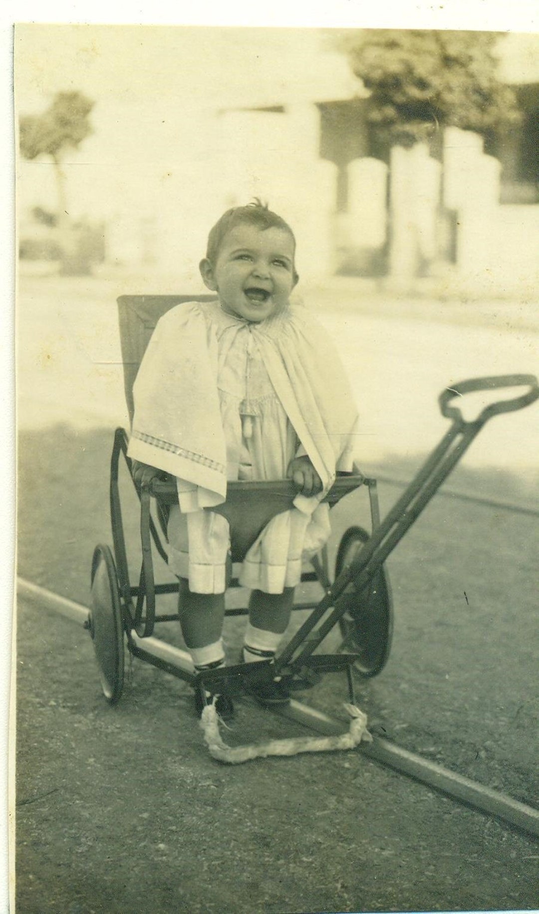 Happy Laughing Baby Standing in Stroller Cape Street Car Track Road ...