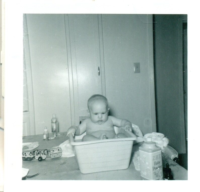1963 Unsure Baby Getting Bath in Basin on Kitchen Table Photo Black ...