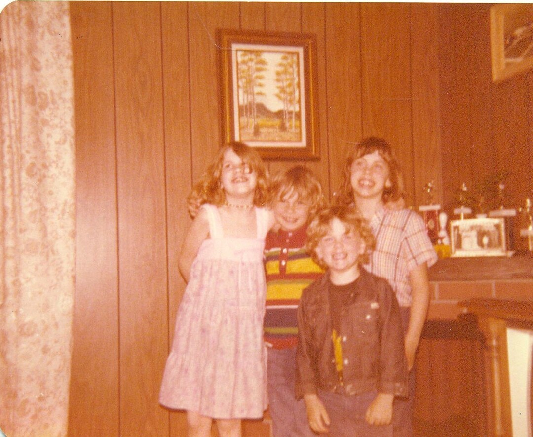 1979 Kids Standing in Wood Panel Living Room Trophies on Mantle ...