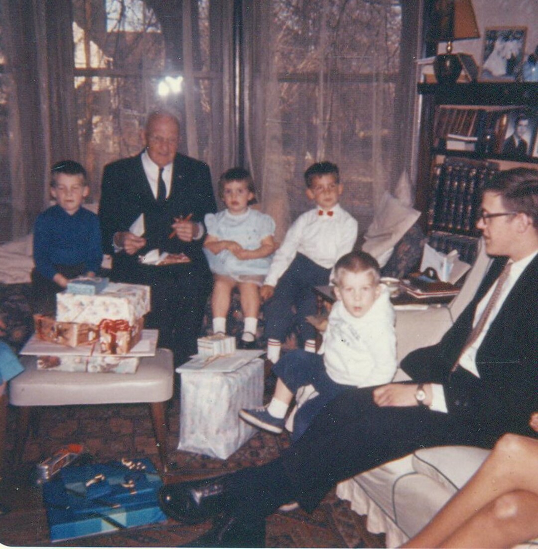 Family Birthday Party Grandfather Opening Presents With Kids Living ...