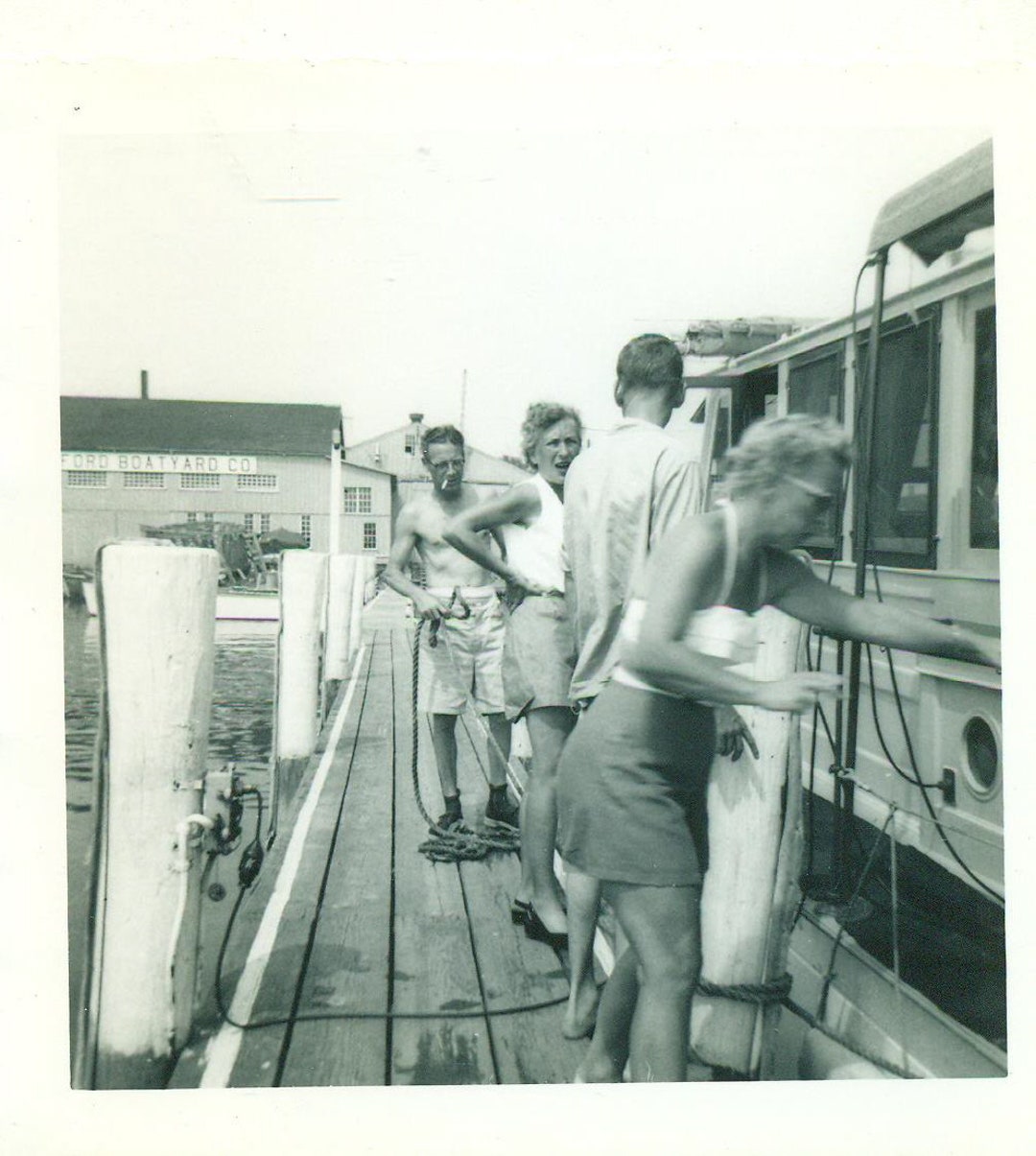 50s Unsure Mom Climbing on Boat From Dock Summer Vacation Woman 1950s ...
