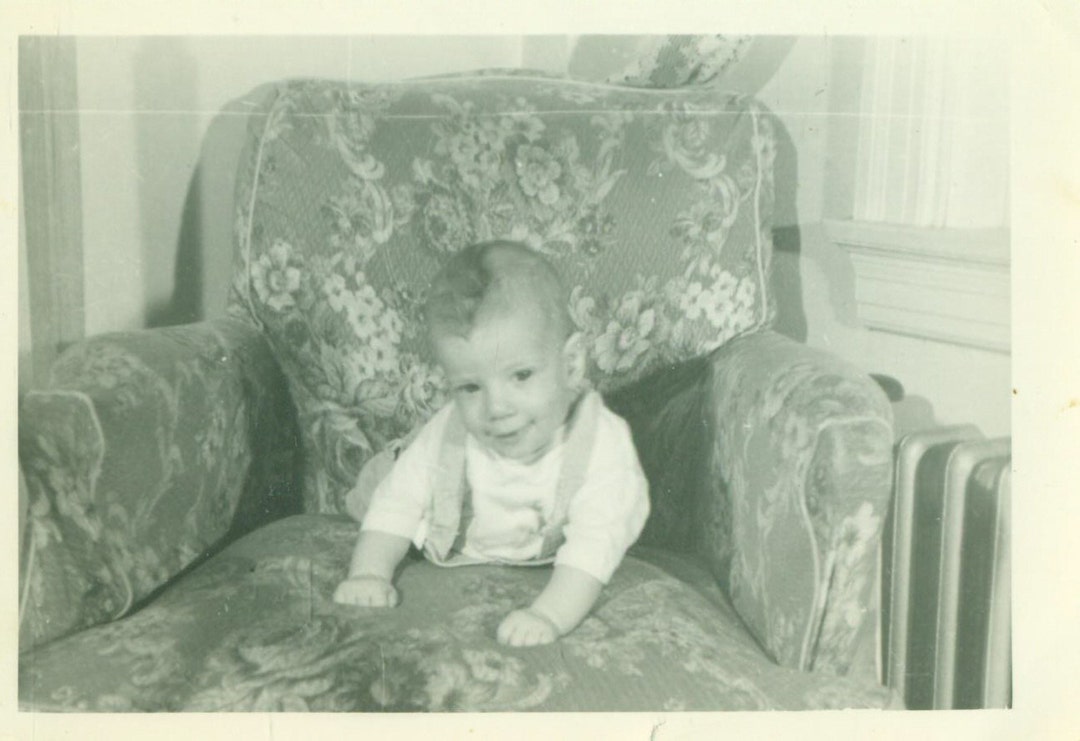 Coy Baby Crawling on Oversized Chair Curly Hair Smile Vintage Black ...