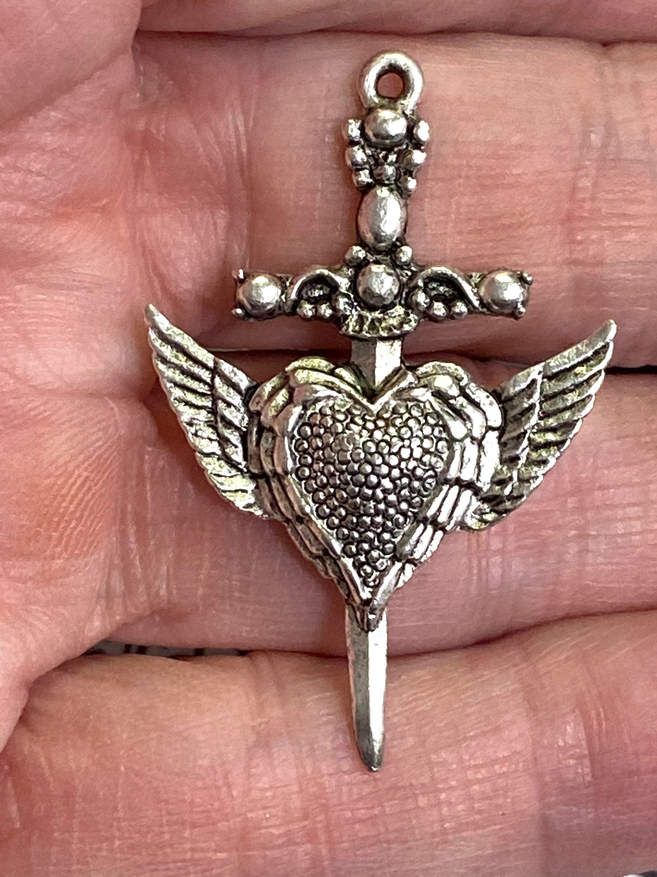 Heart With Dagger And Wings