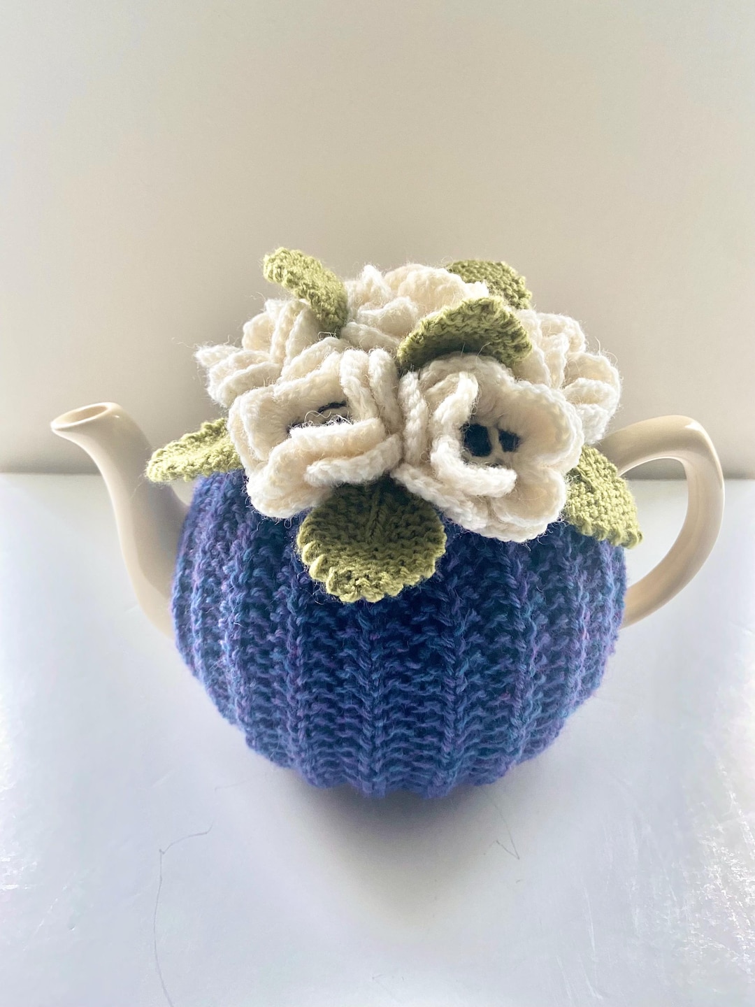 Hand-knitted Floral Tea Cosy in Pure Wool Purple Base & Ivory Flowers Size Medium Fits Standard ...