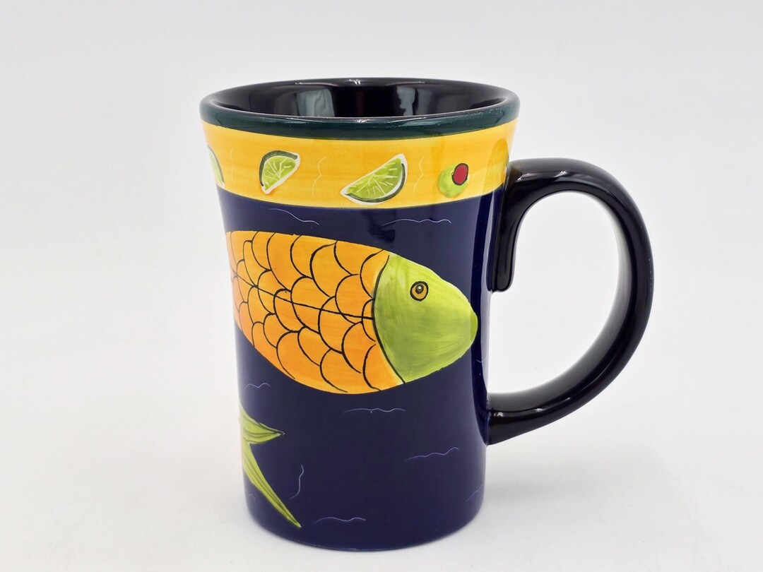 Big Orange and Green Fish Mug With Dark Blue Background and Limes and ...