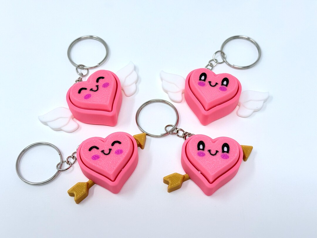 Angel Wings and Cupids Arrow Heart Keychains: Flexi Clicker, Small ...