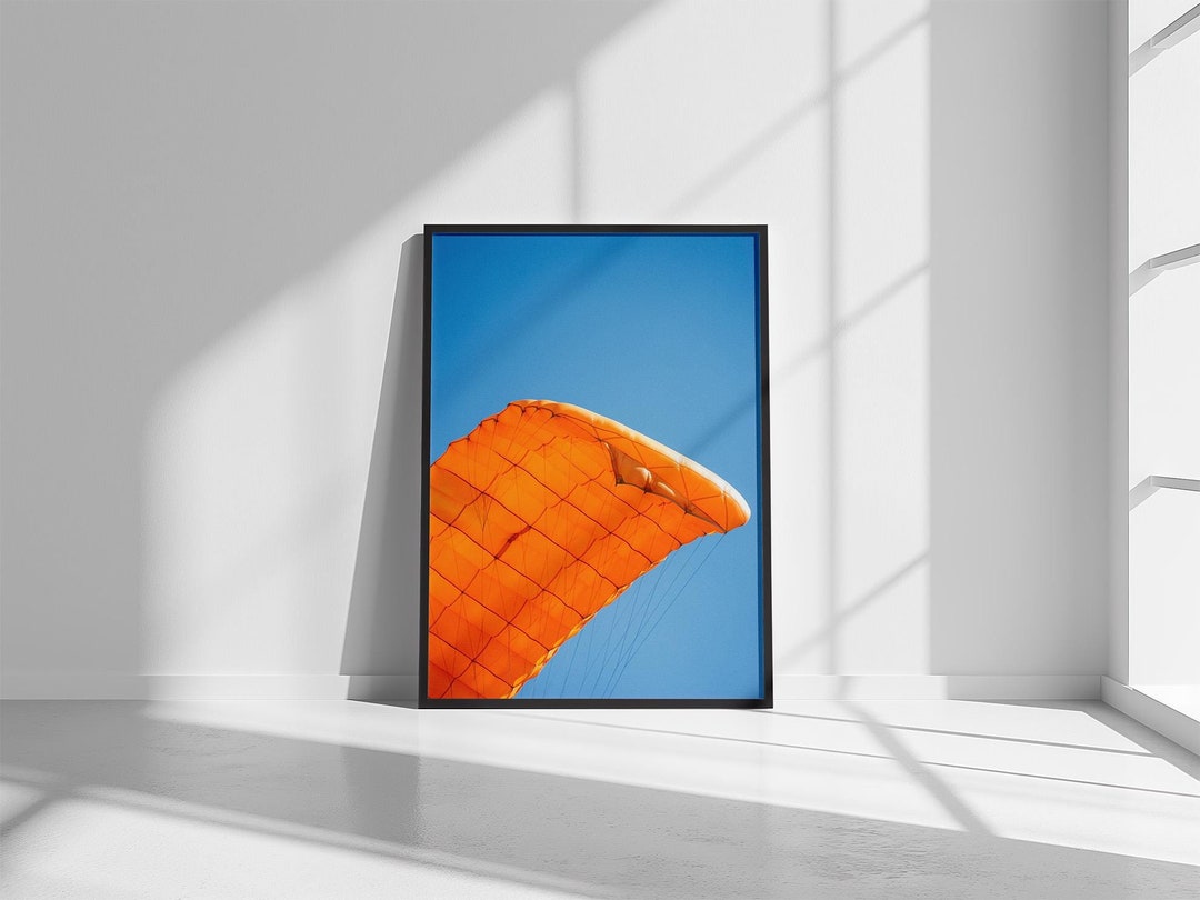 An Orange Parachute in A Clear Blue Sky, Parachuting and Skydiving ...