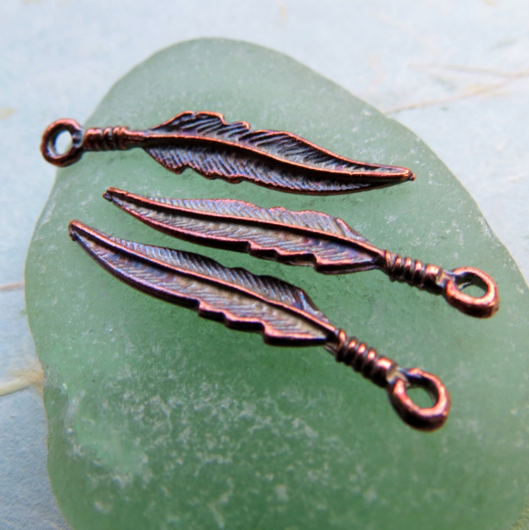 BRONZED FLOWING FEATHERS . 25 Mm . 5 Pieces . Mykonos Greek Charms ...