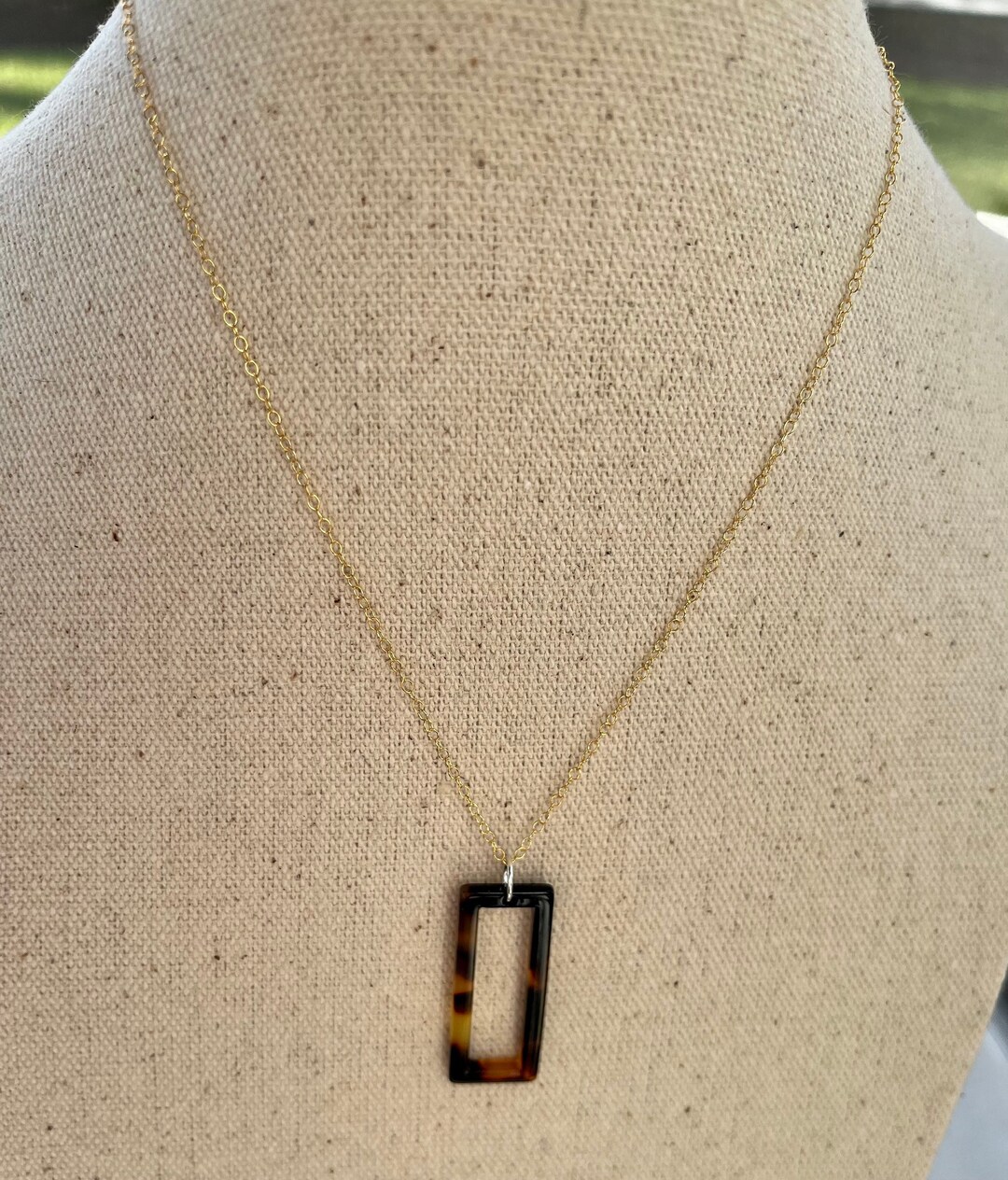 The suze Collection Tortoise Shell Pendant Necklace Affixed With ...