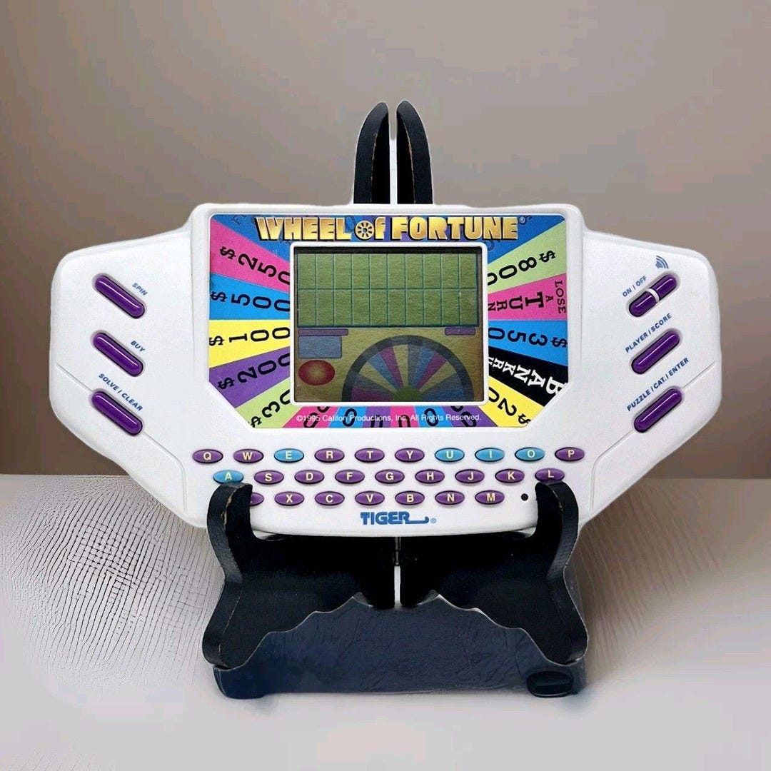 Vintage 1995 Tiger Wheel of Fortune Electronic Handheld Word Puzzle ...