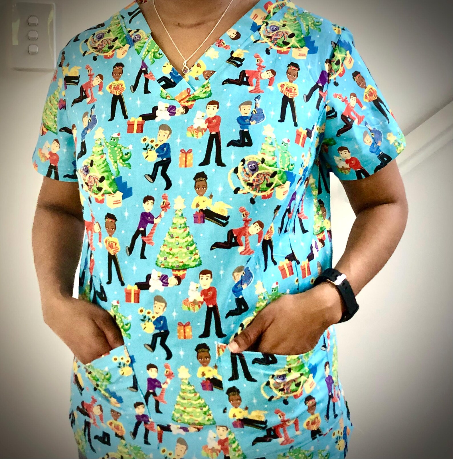 Woman's Wiggles Christmas Scrubs Shirt Festive Holiday Medical Top ...