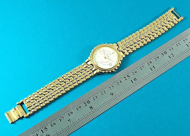 Vintage Nivada Quartz Watch: Swiss Made Gold Plated Wristwatch - Etsy