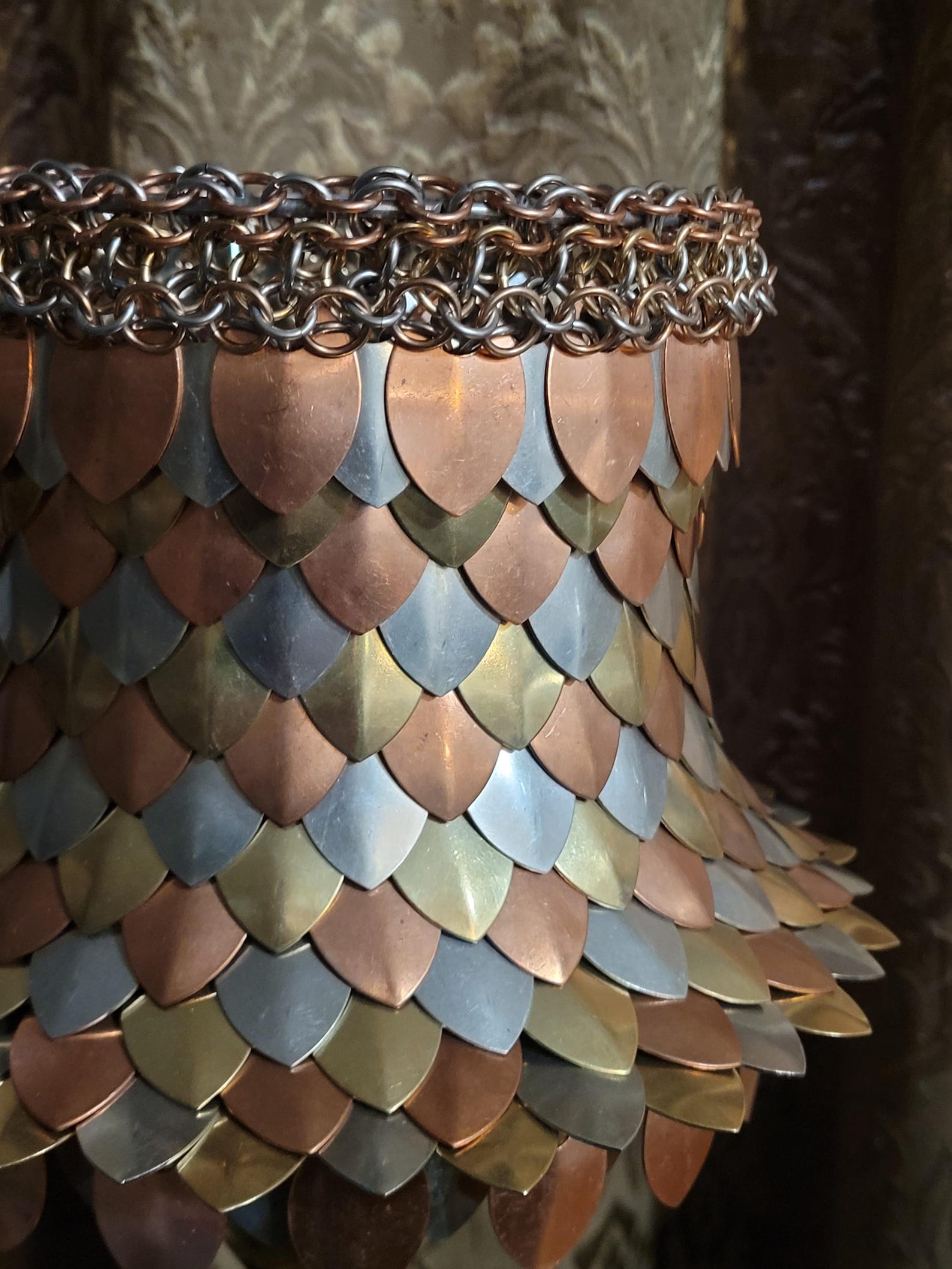 Medieval Multi Color Metal Dragon Scale Lampshade Atop A Pedestal Table ...