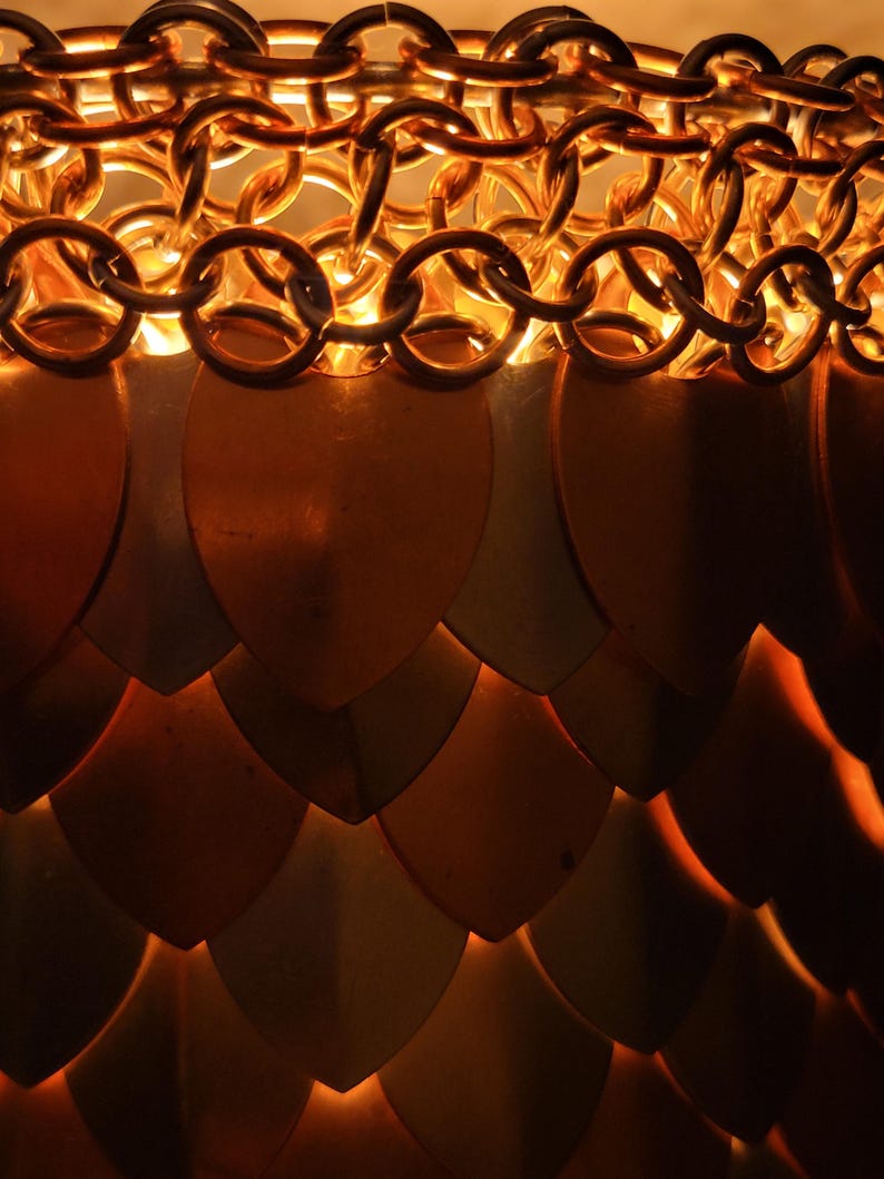 Medieval Multi Color Metal Dragon Scale Lampshade Atop A Pedestal Table ...