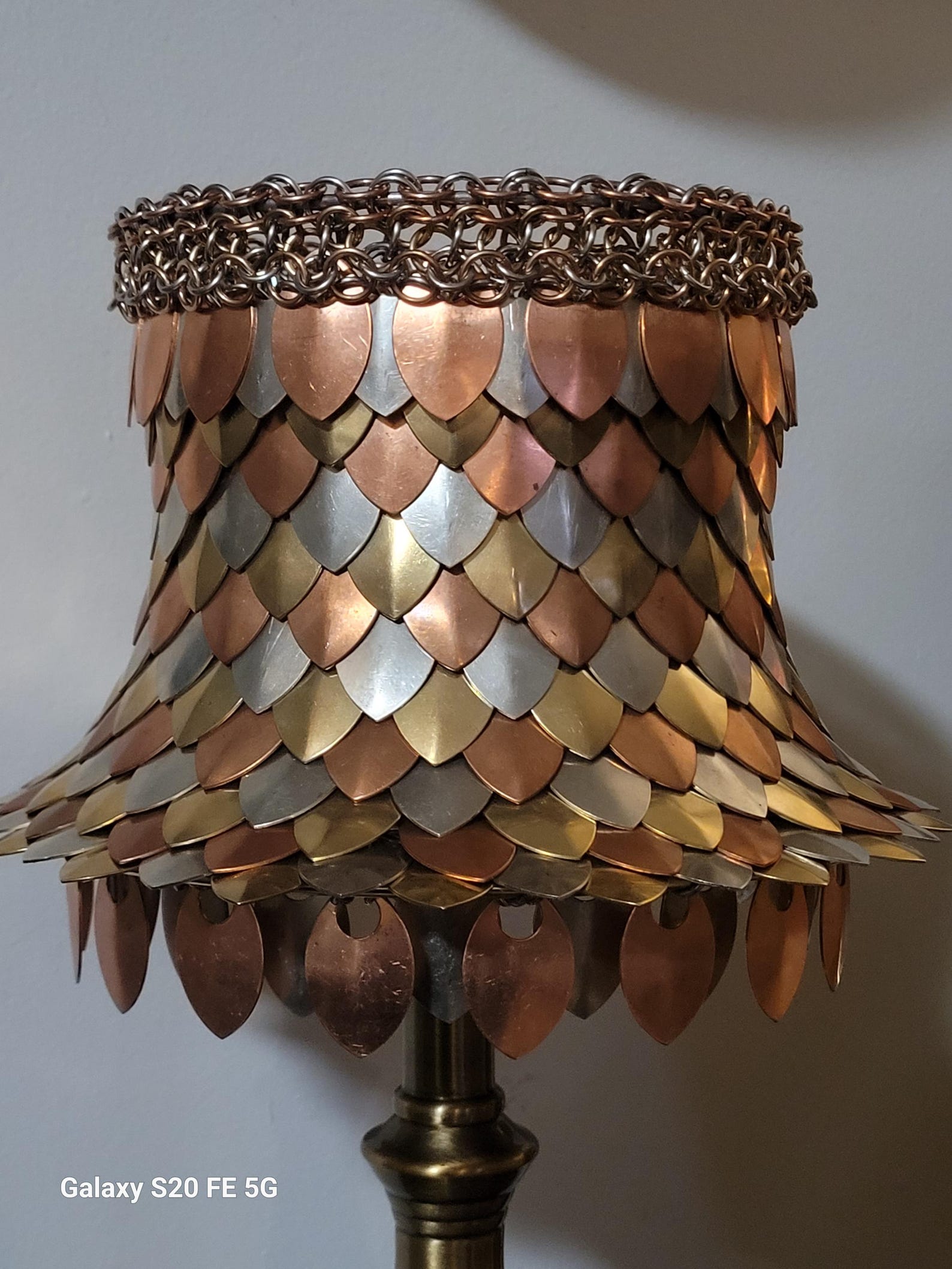 Medieval Multi Color Metal Dragon Scale Lampshade Atop A Pedestal Table ...
