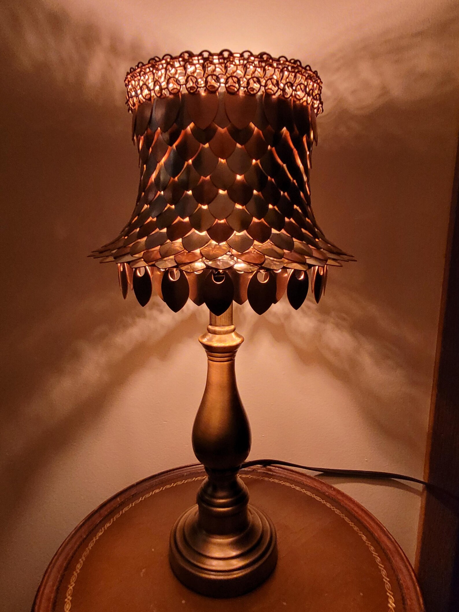 Medieval Multi Color Metal Dragon Scale Lampshade Atop A Pedestal Table ...
