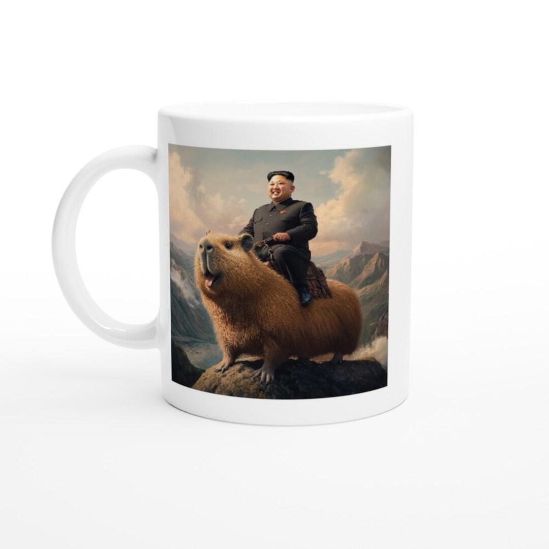 Kim on a Capibara Mug - Capybara - Kim Jong Un - North Korea - Funny ...