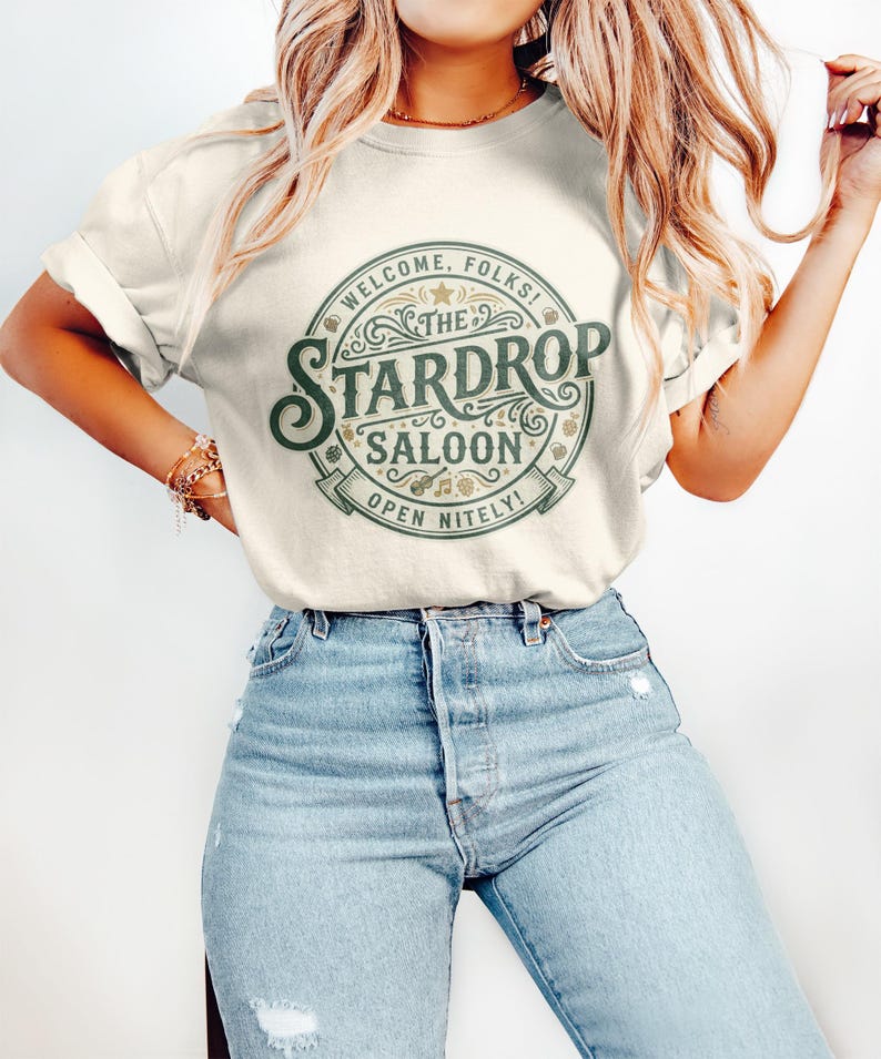 Stardrop Saloon Shirt, Stardew Valley T-shirts + Sweatshirts, Pelican ...