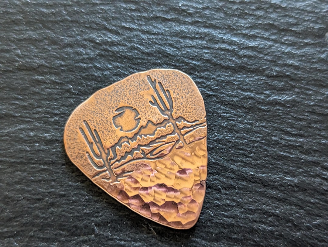 Copper Guitar Pick With Desert Landscape and Cacti and Setting Sun With ...