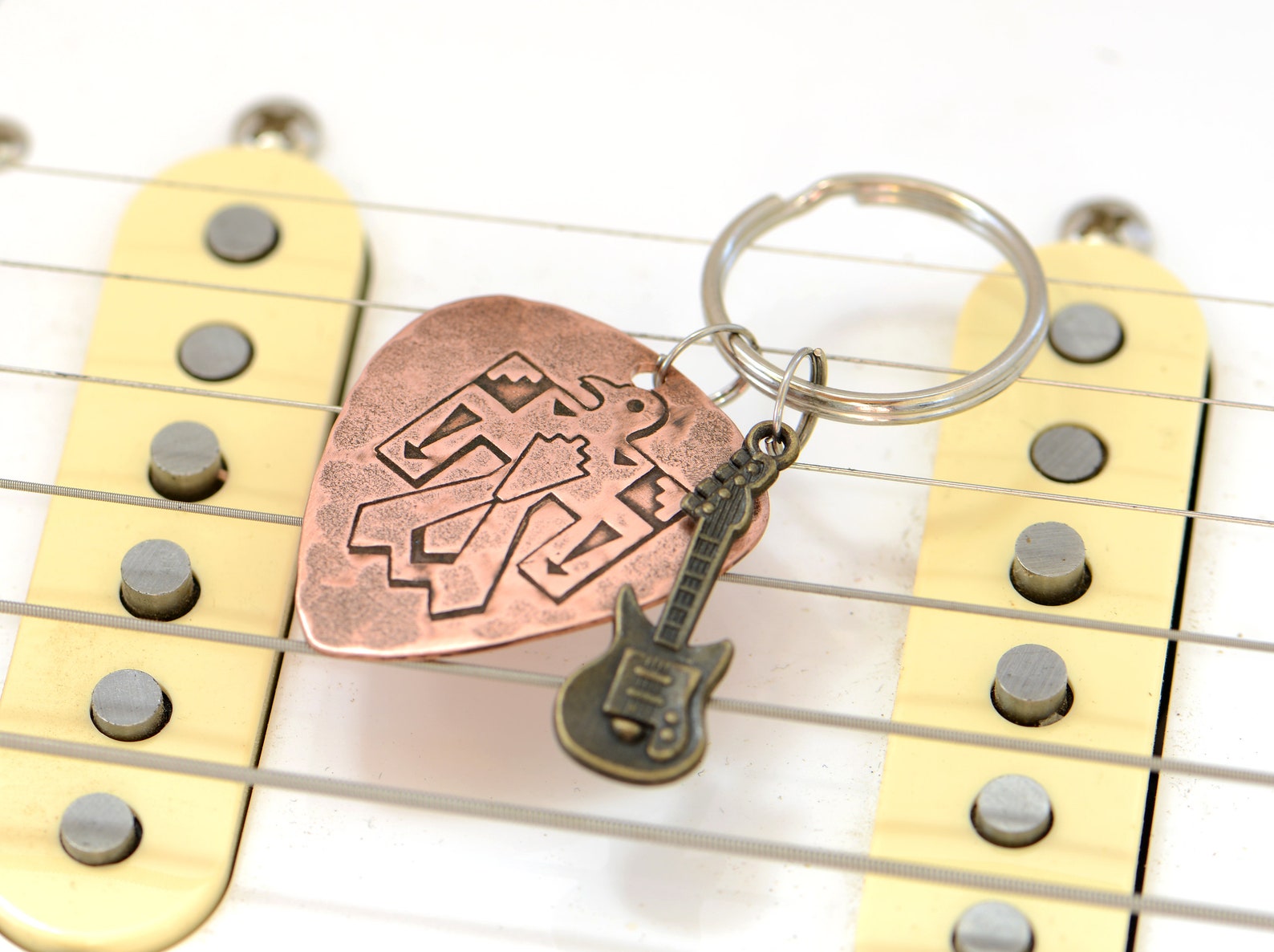 Copper Guitar Pick Keyring With a Thunderbird and Small Brass Guitar ...