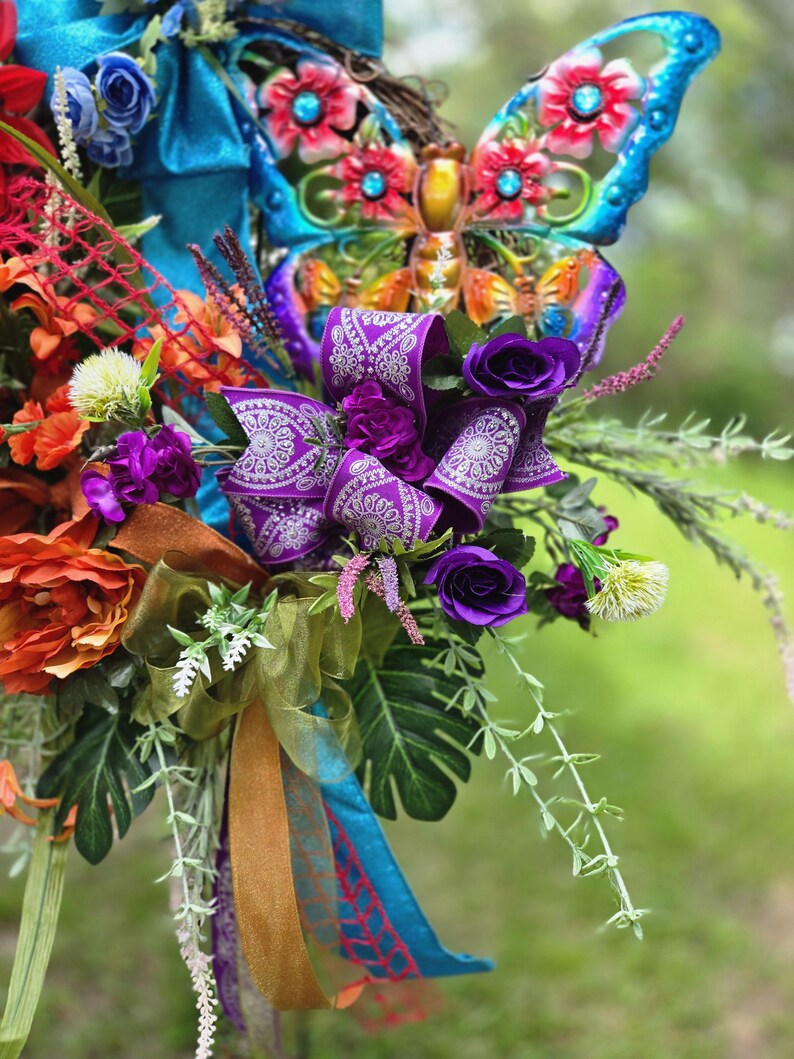 Grapevine Wreath With Metal Butterfly, Ribbons of Blue, Purple, Orange ...