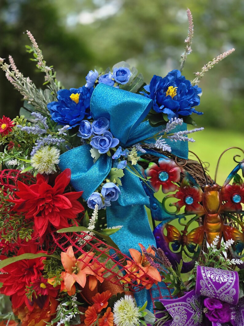 Grapevine Wreath With Metal Butterfly, Ribbons of Blue, Purple, Orange ...