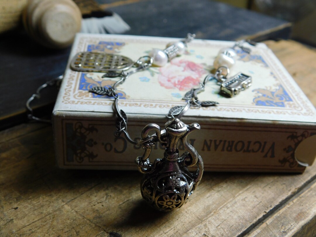 Ms. Doyle's Traveling Trolley Tea Room. Storyteller Necklace Neck Art ...
