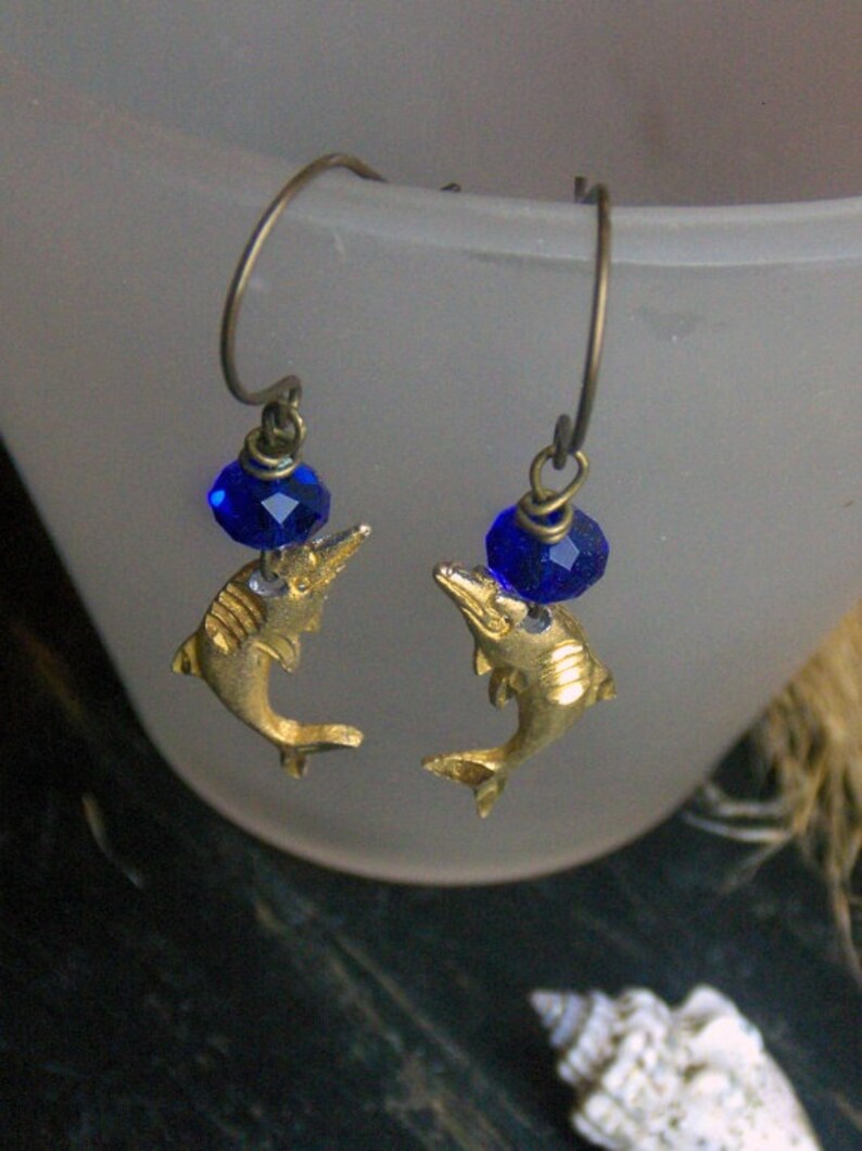 The Delphic Blue Earrings. Brass Dolphins and Royal Blue Czech Glass ...