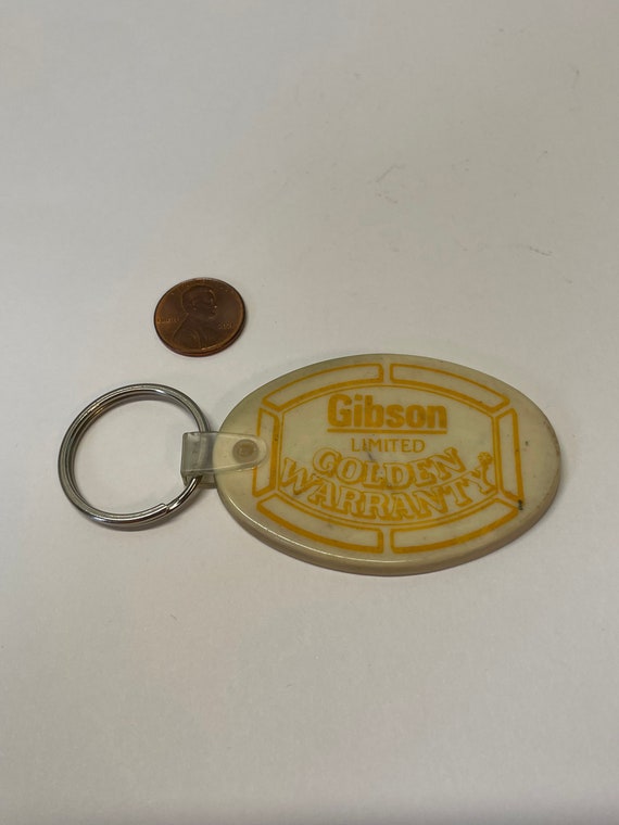 Vintage Gibson Golden Warranty Rubber Keychain - Gem