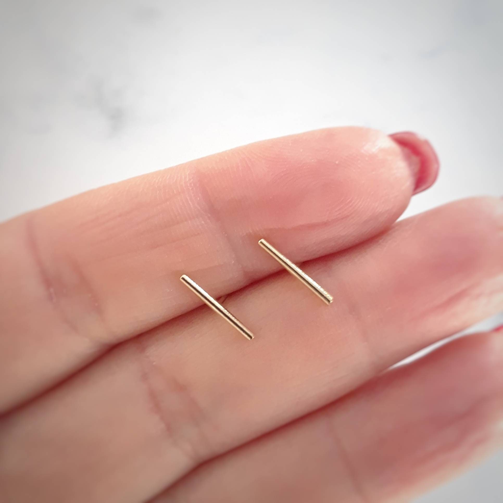 Tiny gold bar earrings store