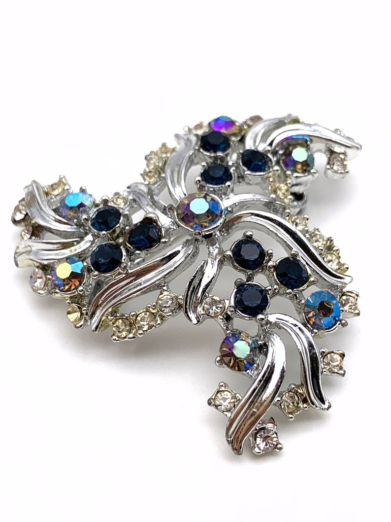 Middle Blue and AB Rhinestones Swirl Design Brooch Accentuated by Clear ...