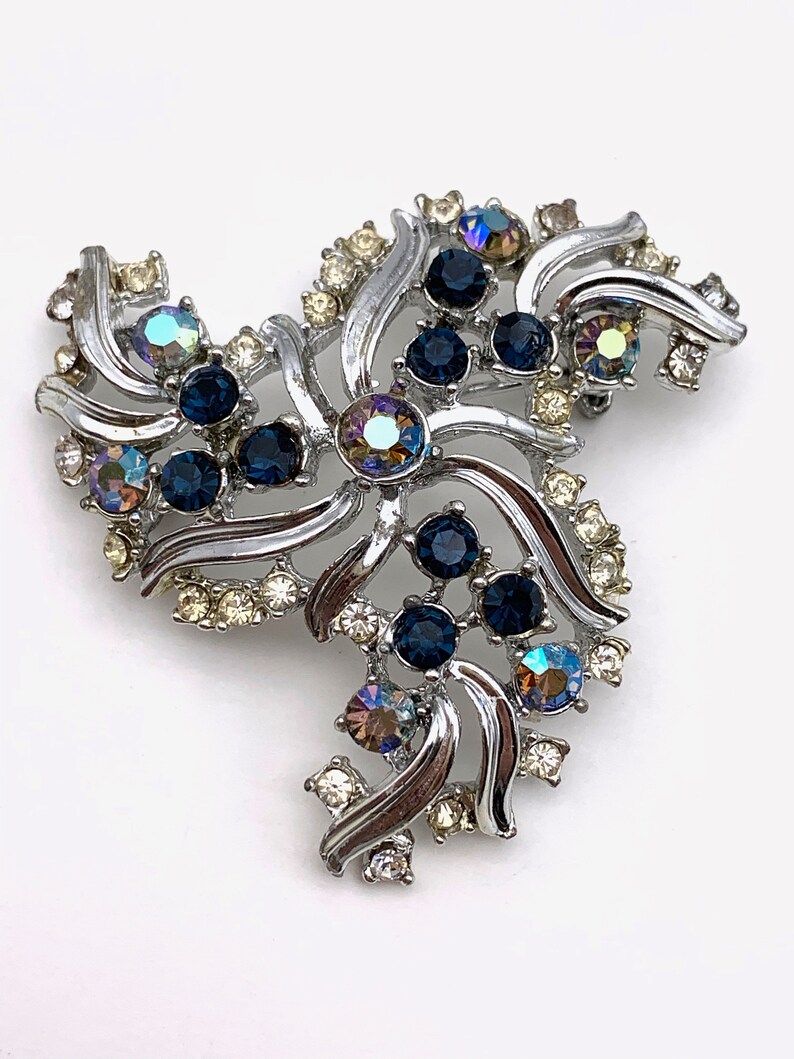 Middle Blue and AB Rhinestones Swirl Design Brooch Accentuated by Clear ...