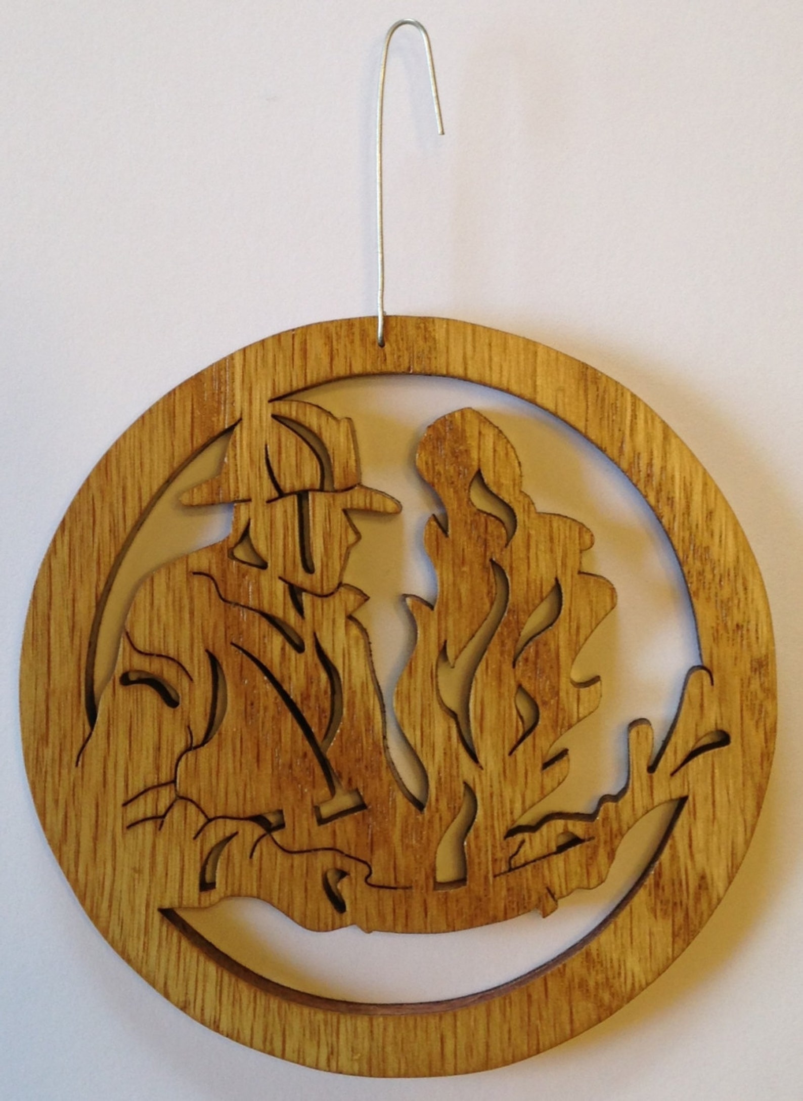 Scroll Saw Cut Woodworking Firefighter Ornament of a Firefighter With a ...