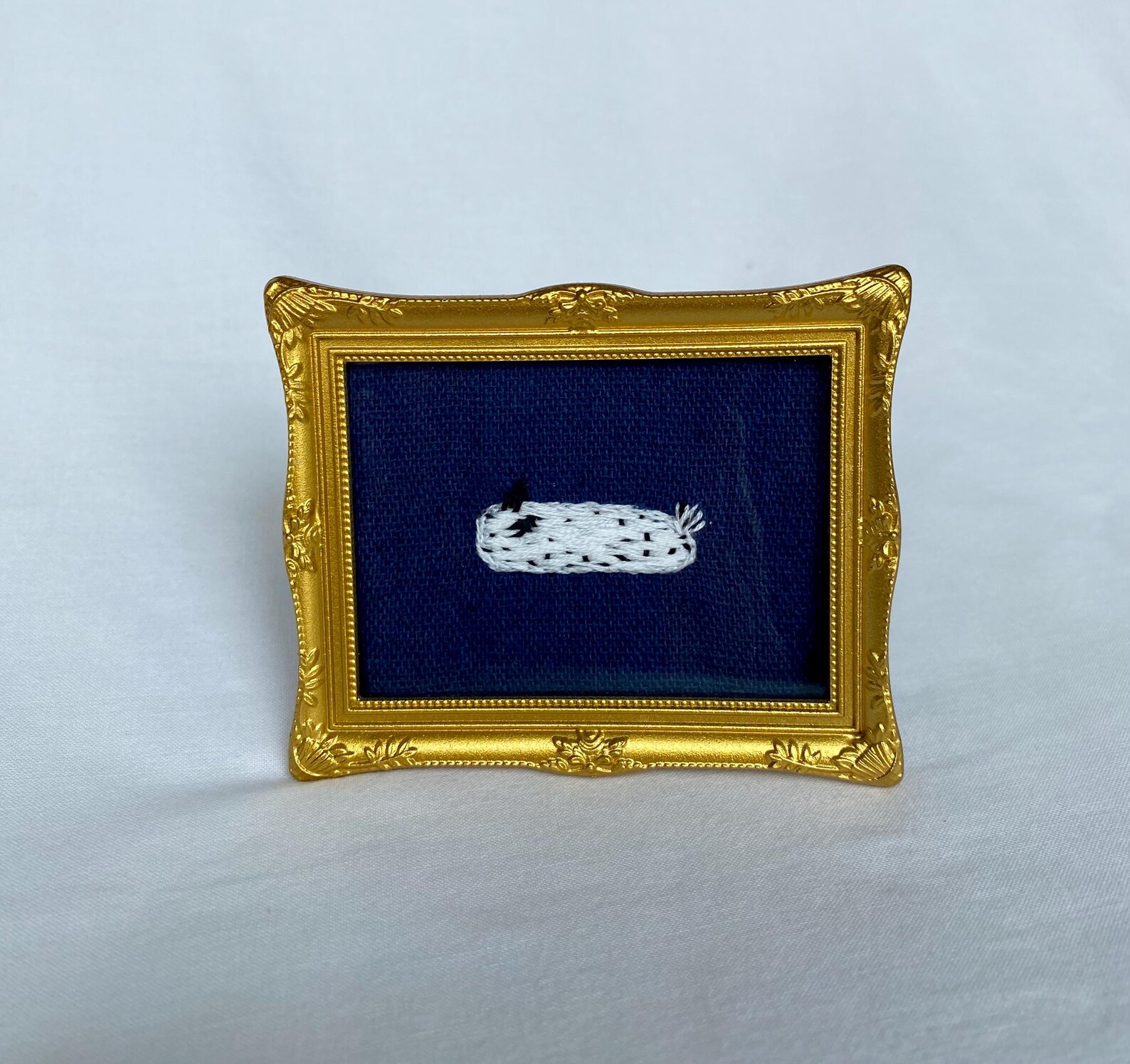 Sea Bunny Slug Hand Embroidery Art Navy Linen in Golden Magnetic ...