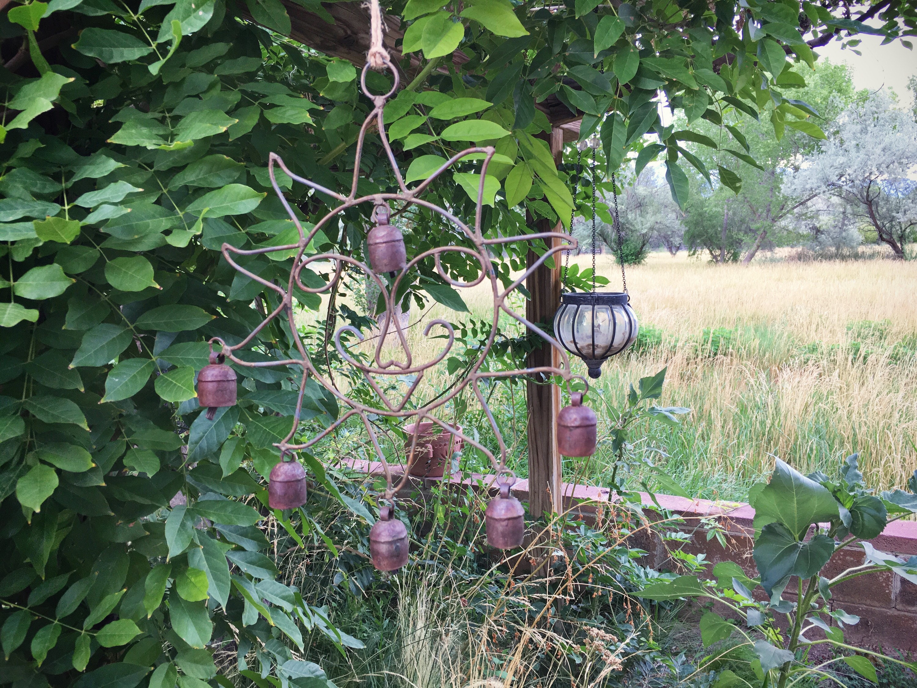 Vintage smiling sun wind chime rusty metal cow bells metal windchimes ...