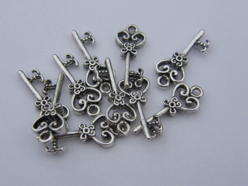 12 Key charms antique silver tone K24 | Etsy