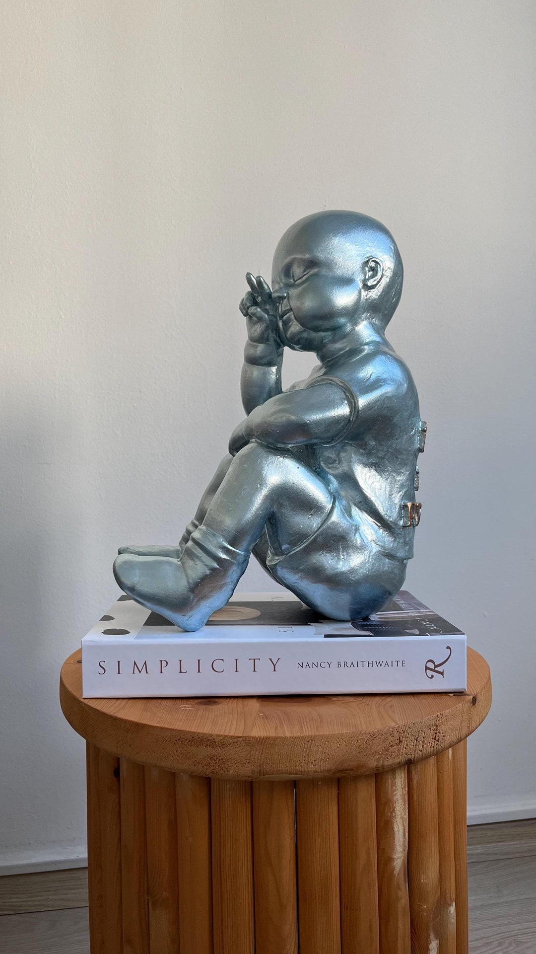 Bright Blue Finger Pointing Child Sculpture Sitting 2 Finger Gesture ...