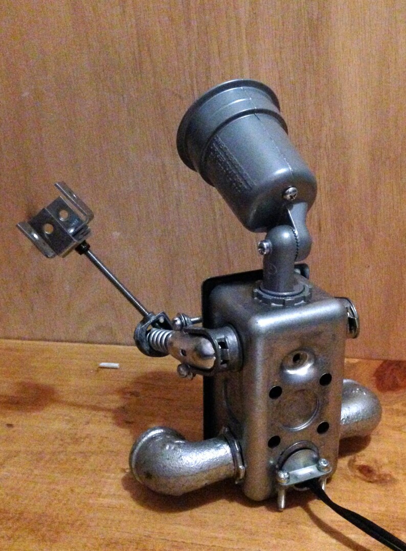 Lámpara Robot con flor de metal - Etsy España