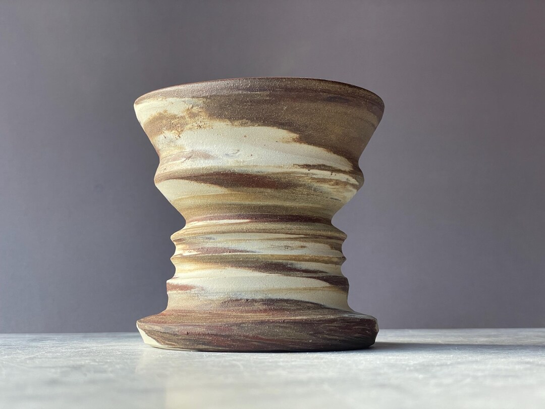 Hidden faces cup op art negative space profile heads ikebana vessel ...