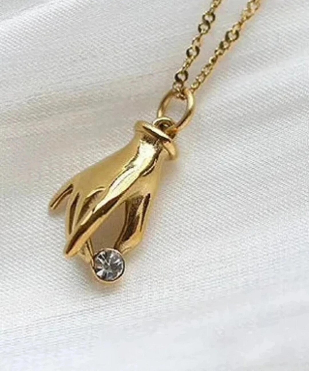 Destiny Necklace - Small Hand Holding a Zircon Diamond Set on Adainty ...