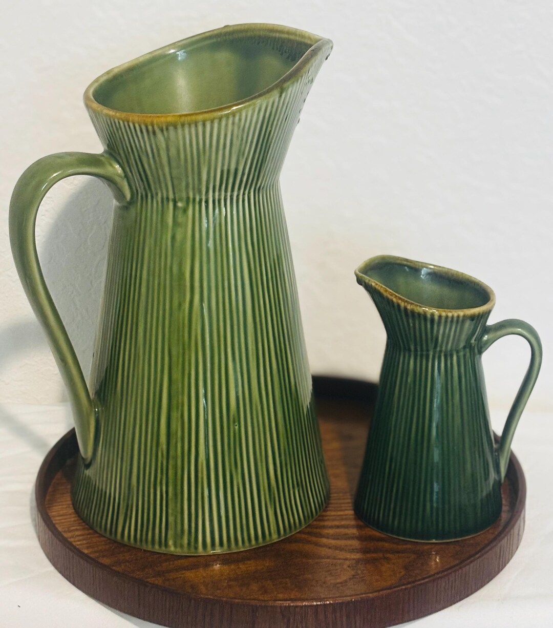 This is a Set of a Green Ceramic Pitcher and Creamer Set in the "lotus ...