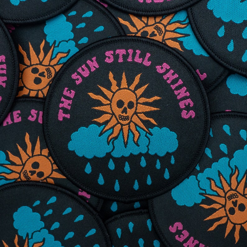 The Sun Still Shines Patch. Woven Iron on Sun Skull Clouds Rain Patch ...