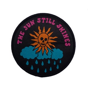 The Sun Still Shines Patch. Woven Iron on Sun Skull Clouds Rain Patch ...