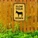 Vintage-style "slow Your Donkey Down" Sign - Rustic Yellow Background ...