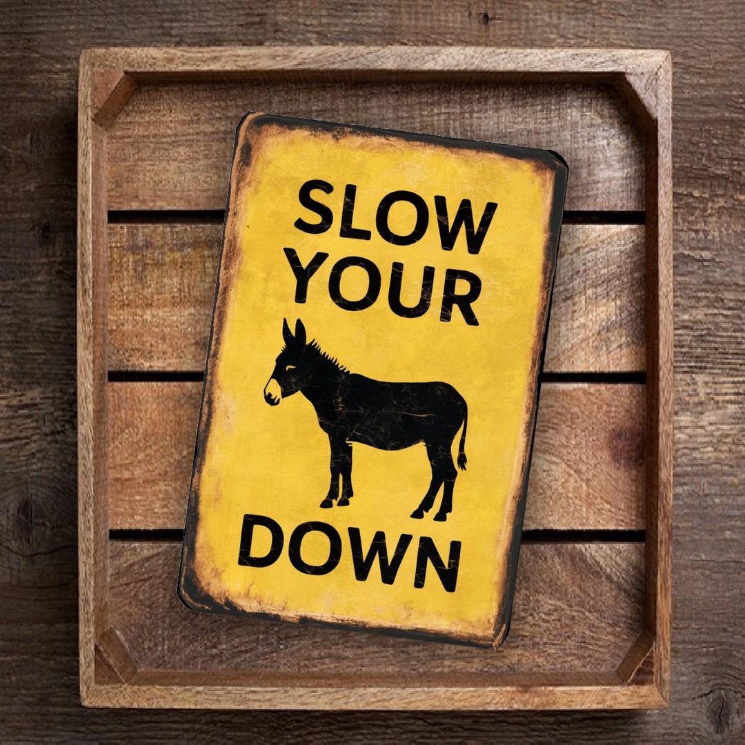 Vintage-style slow Your Donkey Down Sign Rustic Yellow Background With ...