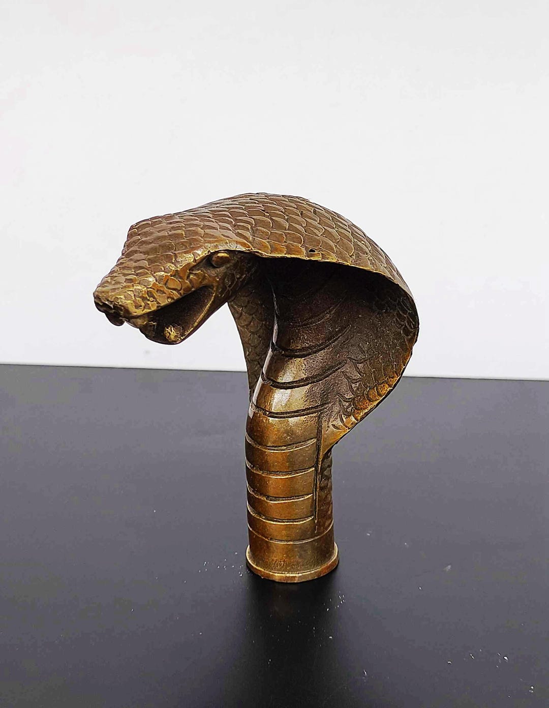 A Handcrafted Brass Cobra-head Cane Topper, Designed as a Thoughtful ...